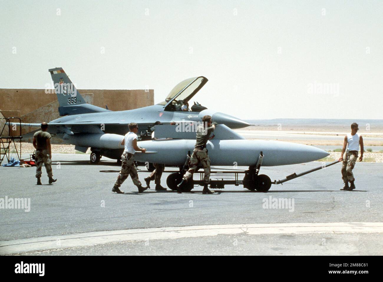 Members of the 33rd Aviation Maintenance Unit move a 370-gallon fuel ...