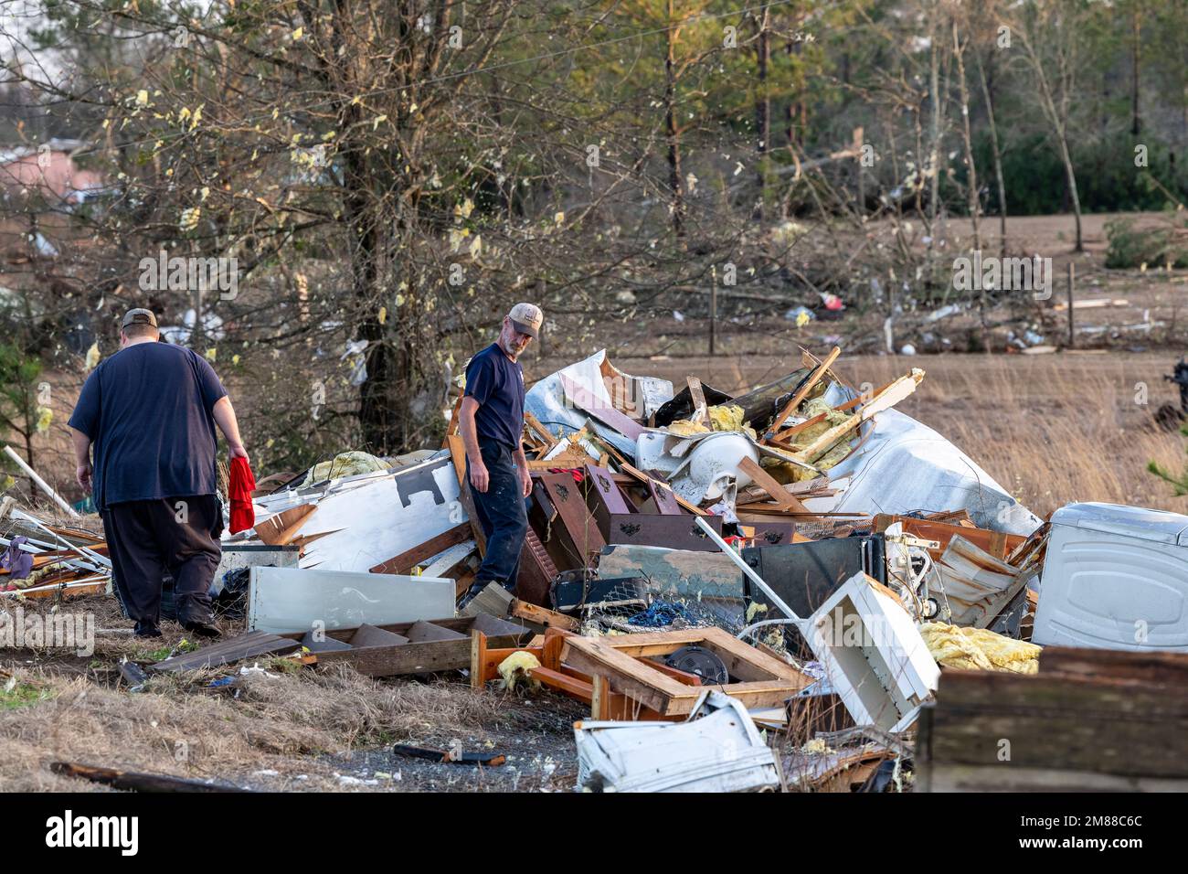 Scott Wayman, center, examines his former rental home at 1349 County ...