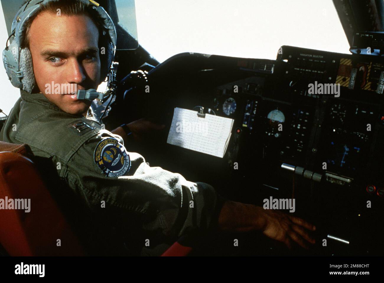 CAPT. Mark G. Vahala, 41st Military Airlift Wing, confers with his ...