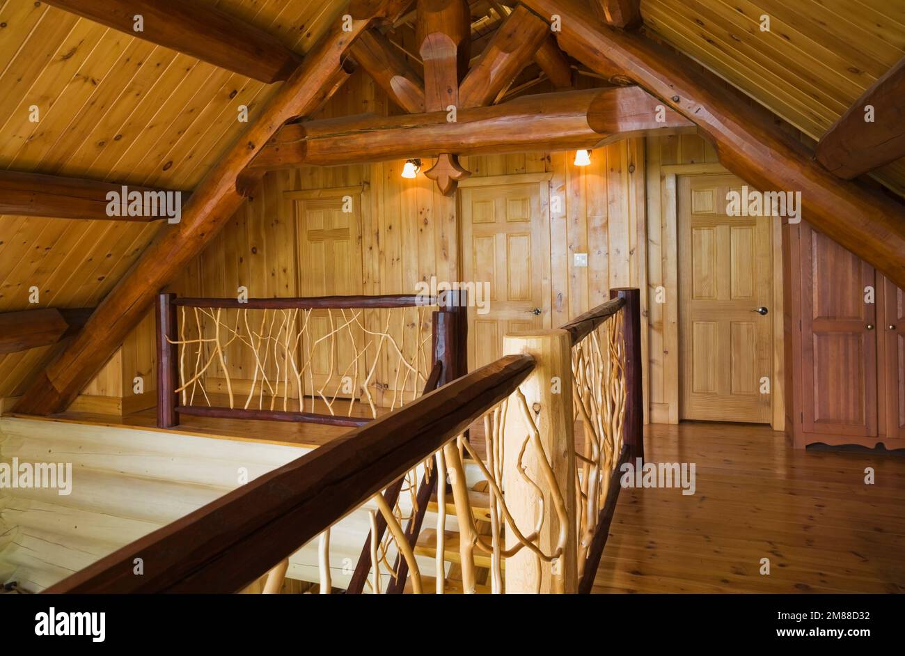 Cedar branch railings and red pine wood floorboards on upstairs floor ...