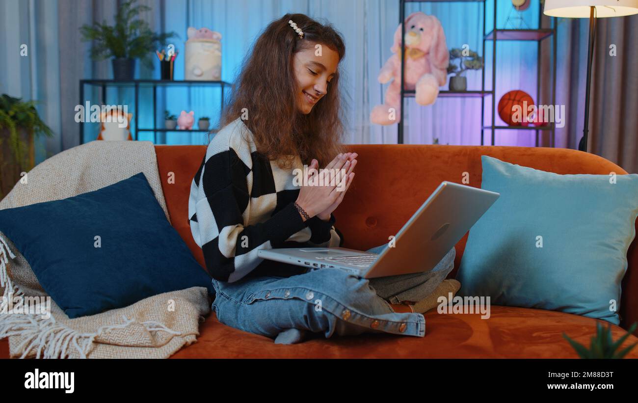 Oh my God Wow. Surprised young girl use laptop computer, receive good ...