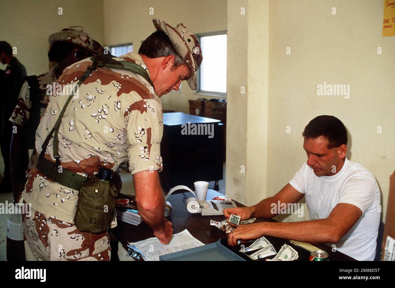 STAFF SGT. Joseph Lavigne of the Air Force Commissary Service acts as ...