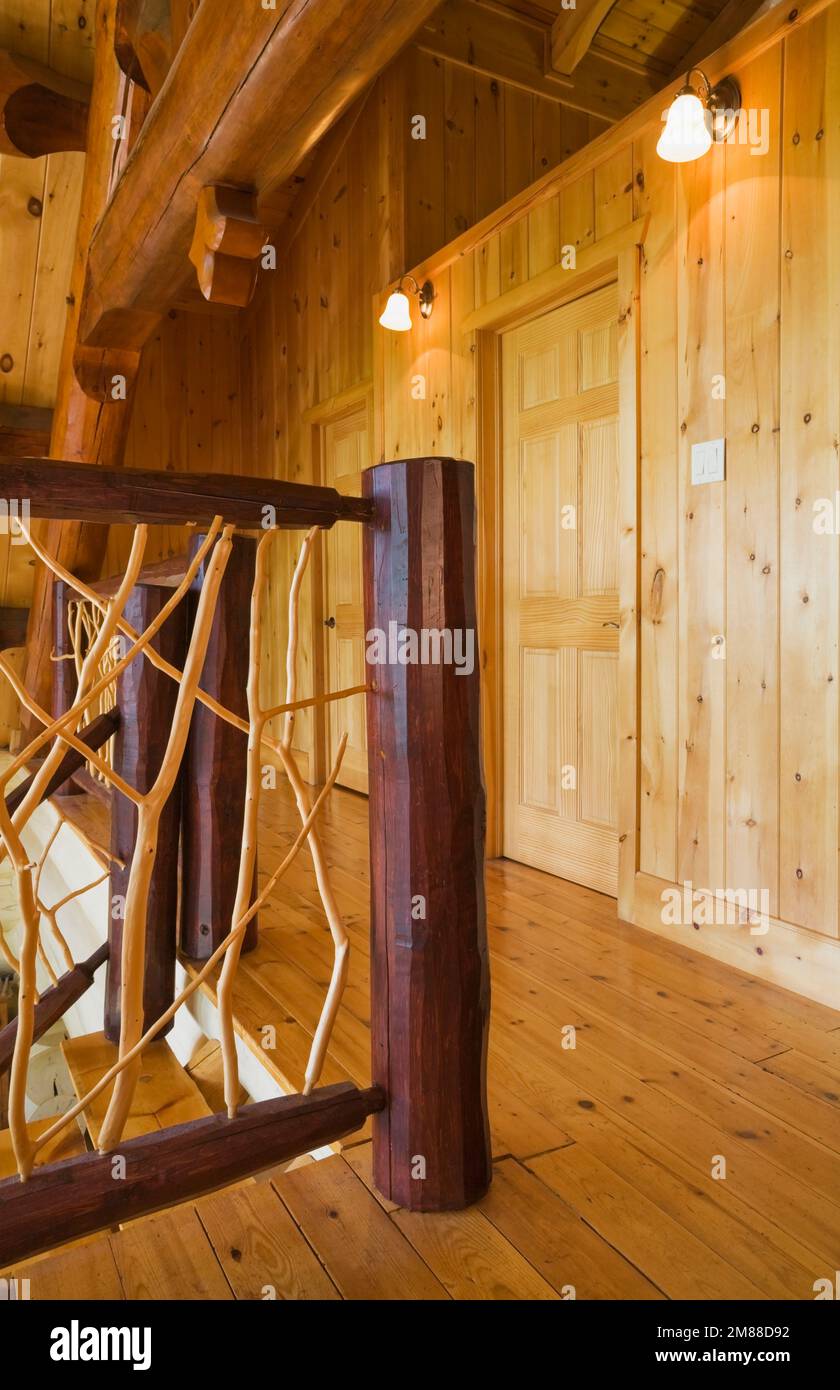 Cedar branch railings and red pine wood floorboards on upstairs floor ...