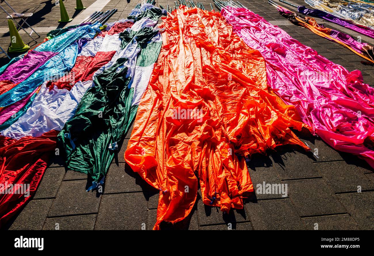 Colorful flags ready to line the Thanksgiving Day Parade route ...