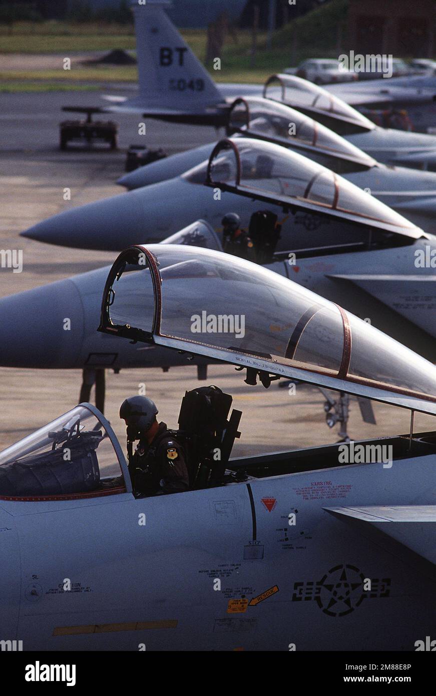 Pilots from the 36th Tactical Fighter Wing open their canopies and pull ...
