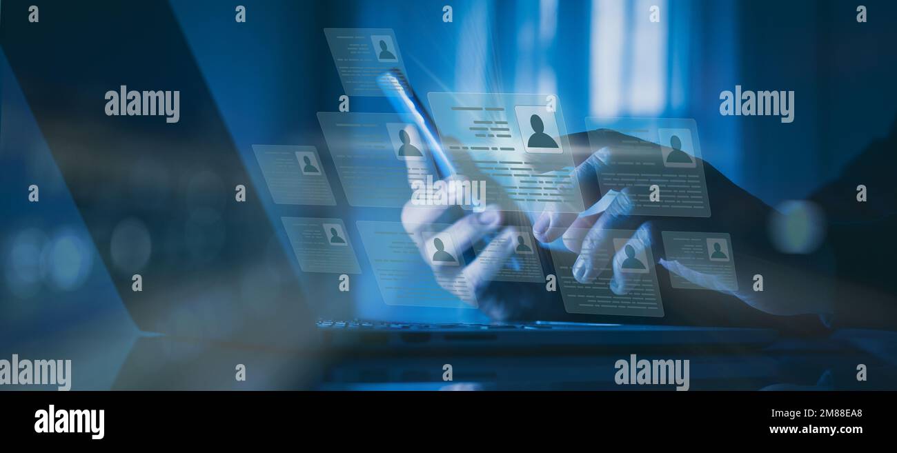 Manager checks CV on virtual screen. Human resource employee choose ...