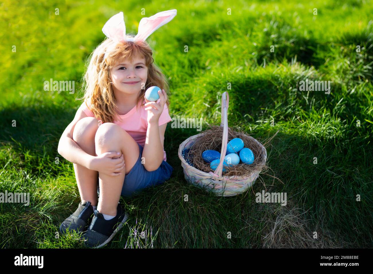 easter basket Happy Easter for children. Boy in bunny ears with ...