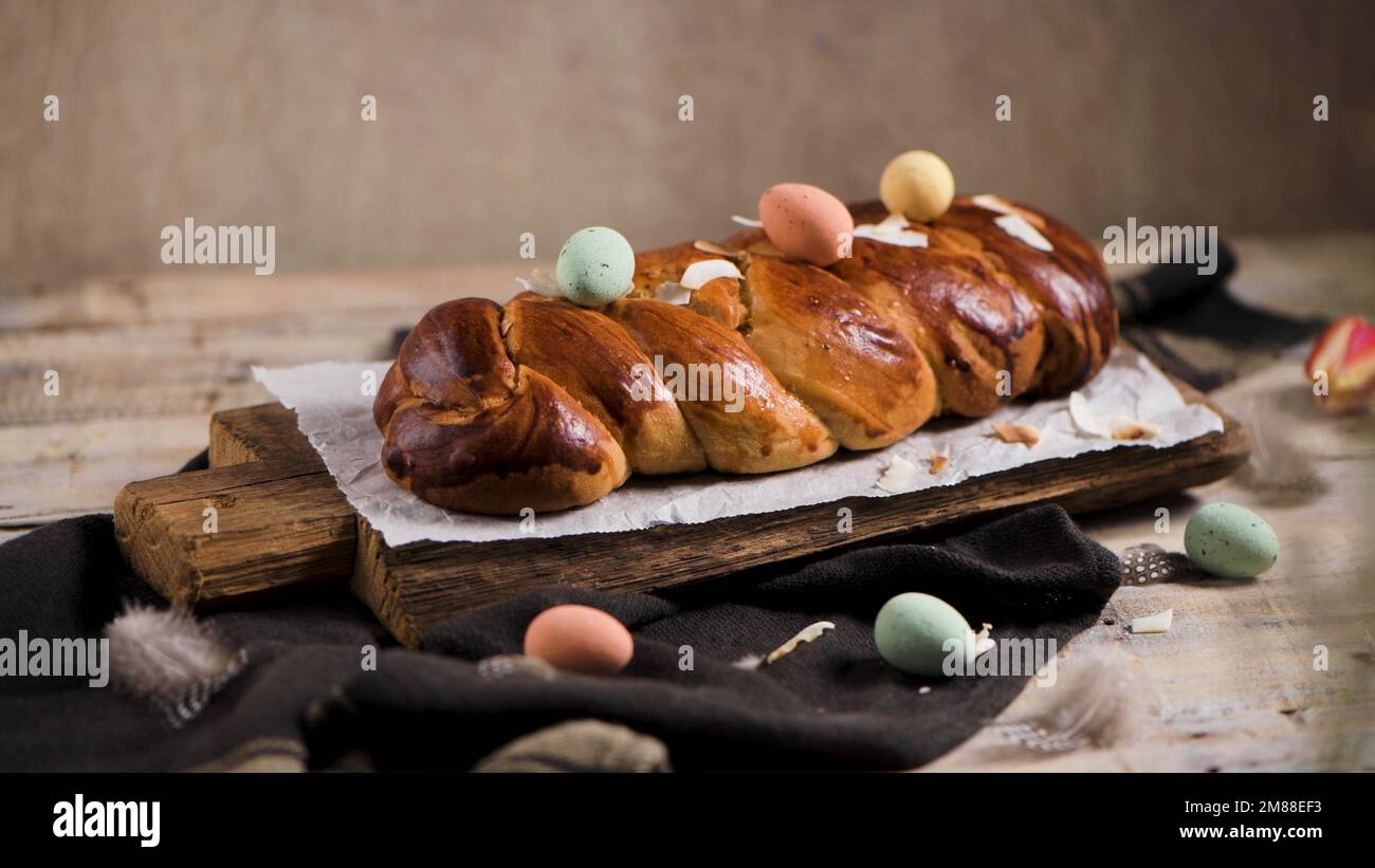 Portuguese traditional Easter cake. Folar with eggs on easter table ...