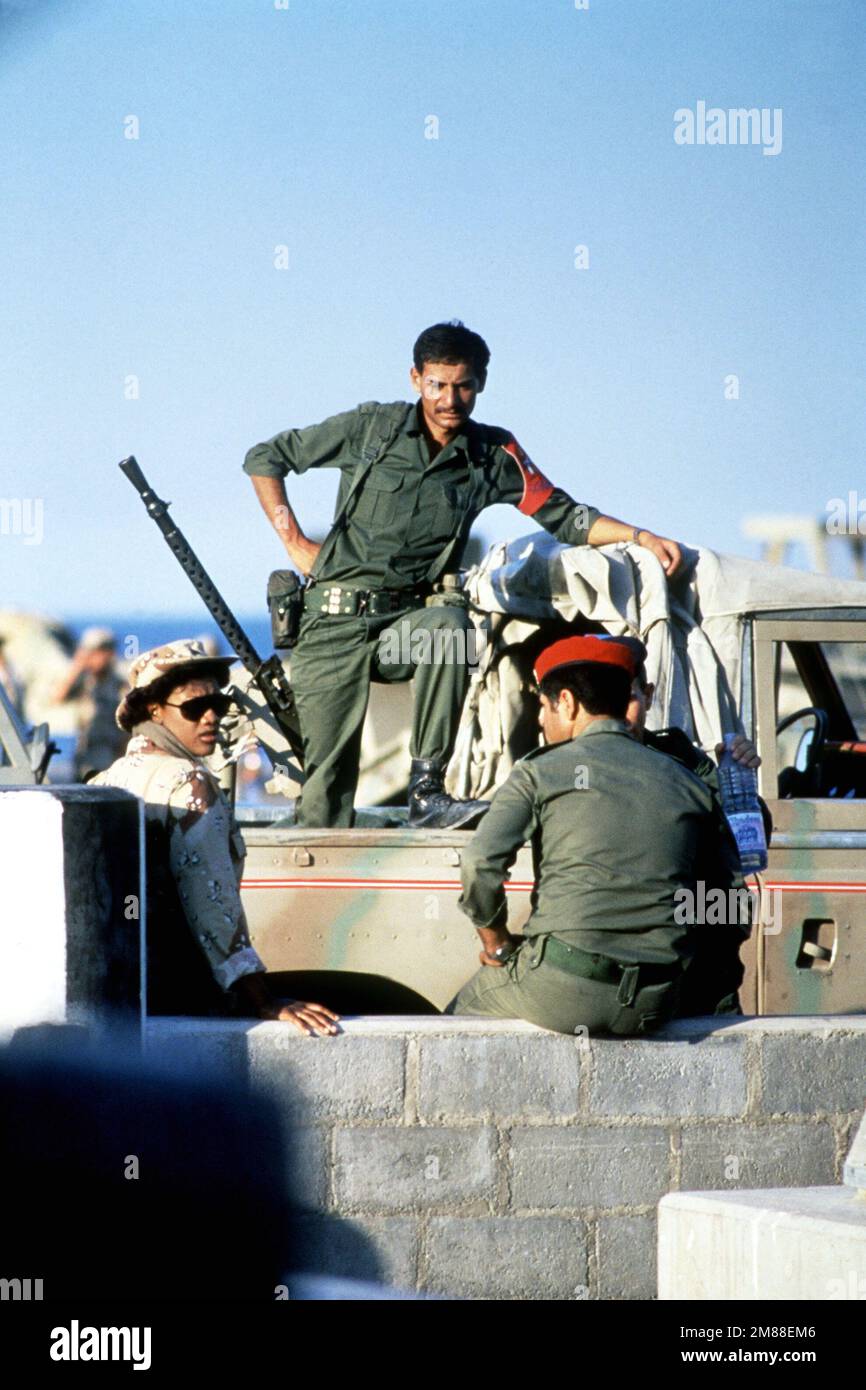 Members of the US and Jordanian military services take a brake from ...