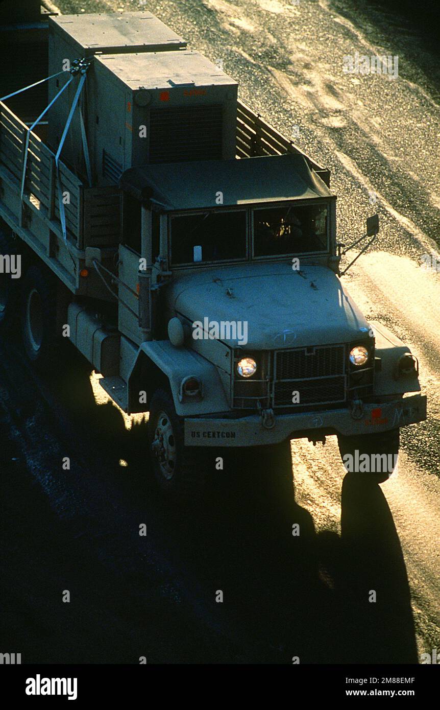 An M-35A2 2-1/2-ton cargo truck moves out from the port at Aqaba to be ...