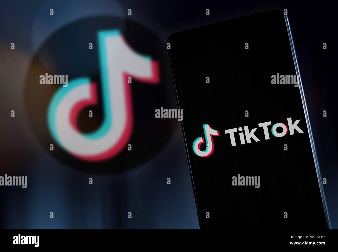 Tik Tok logo on smartphone display and background. Communication ...