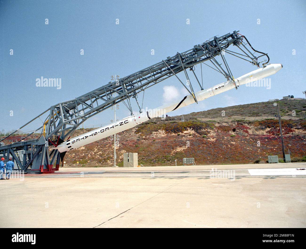 A Scout launch vehicle is erected on a launch tower. Base: Vandenberg ...