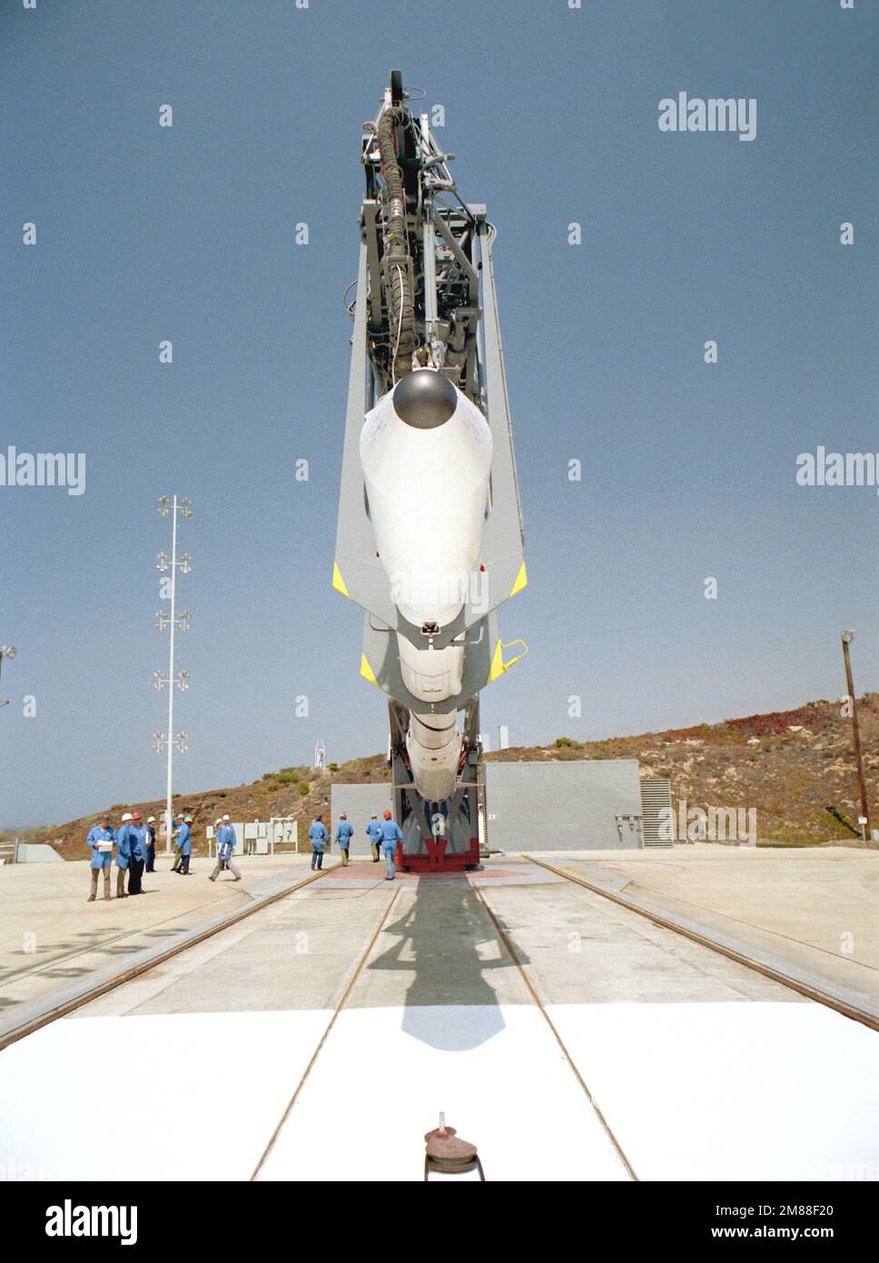 A Scout launch vehicle is erected on a launch tower. Base: Vandenberg ...