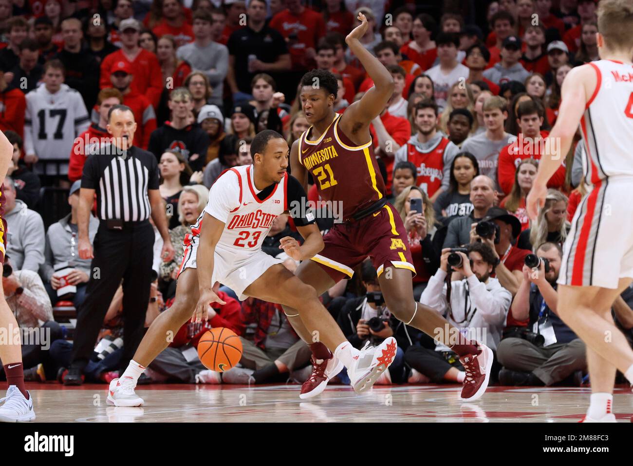 Ohio State's Zed Key, left, is defended by Minnesota's Pharrel Payne ...