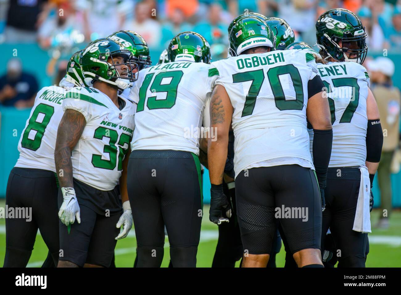 New York Jets quarterback Joe Flacco (19) calls a play in the huddle ...