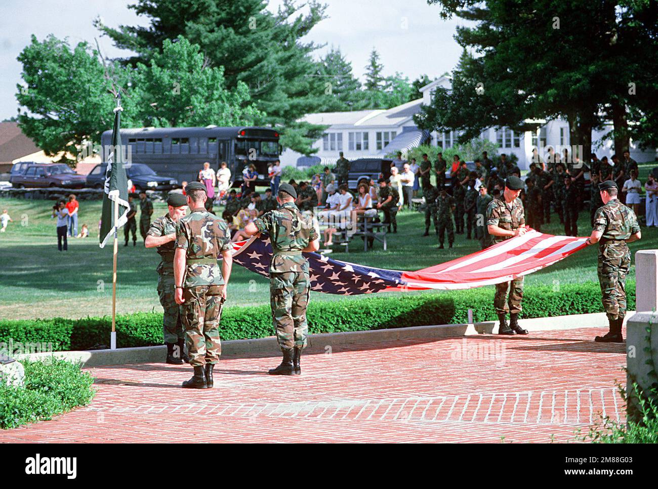 Members of the 10th Special Forces Group (Airborne) fold the flag at ...