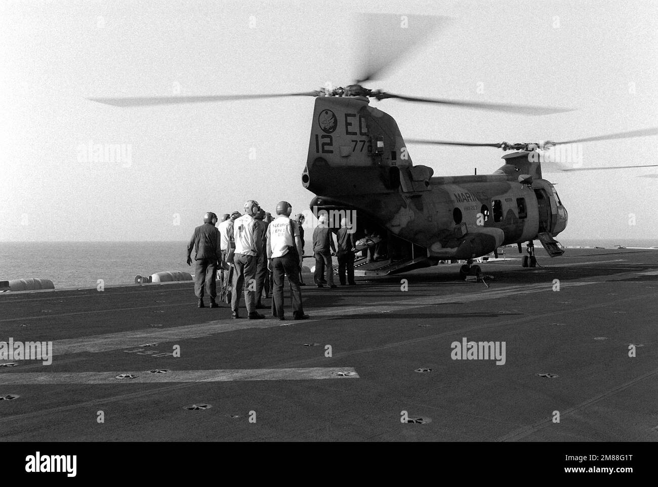 Armed crew members aboard the amphibious transport dock USS RALEIGH ...