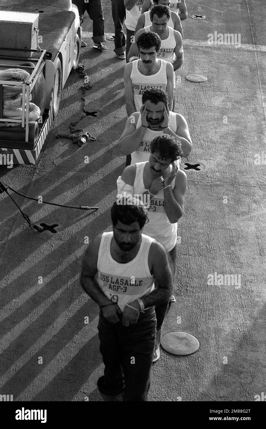 Iranian detainees from the mine-laying ship IRAN AJR assemble on the ...