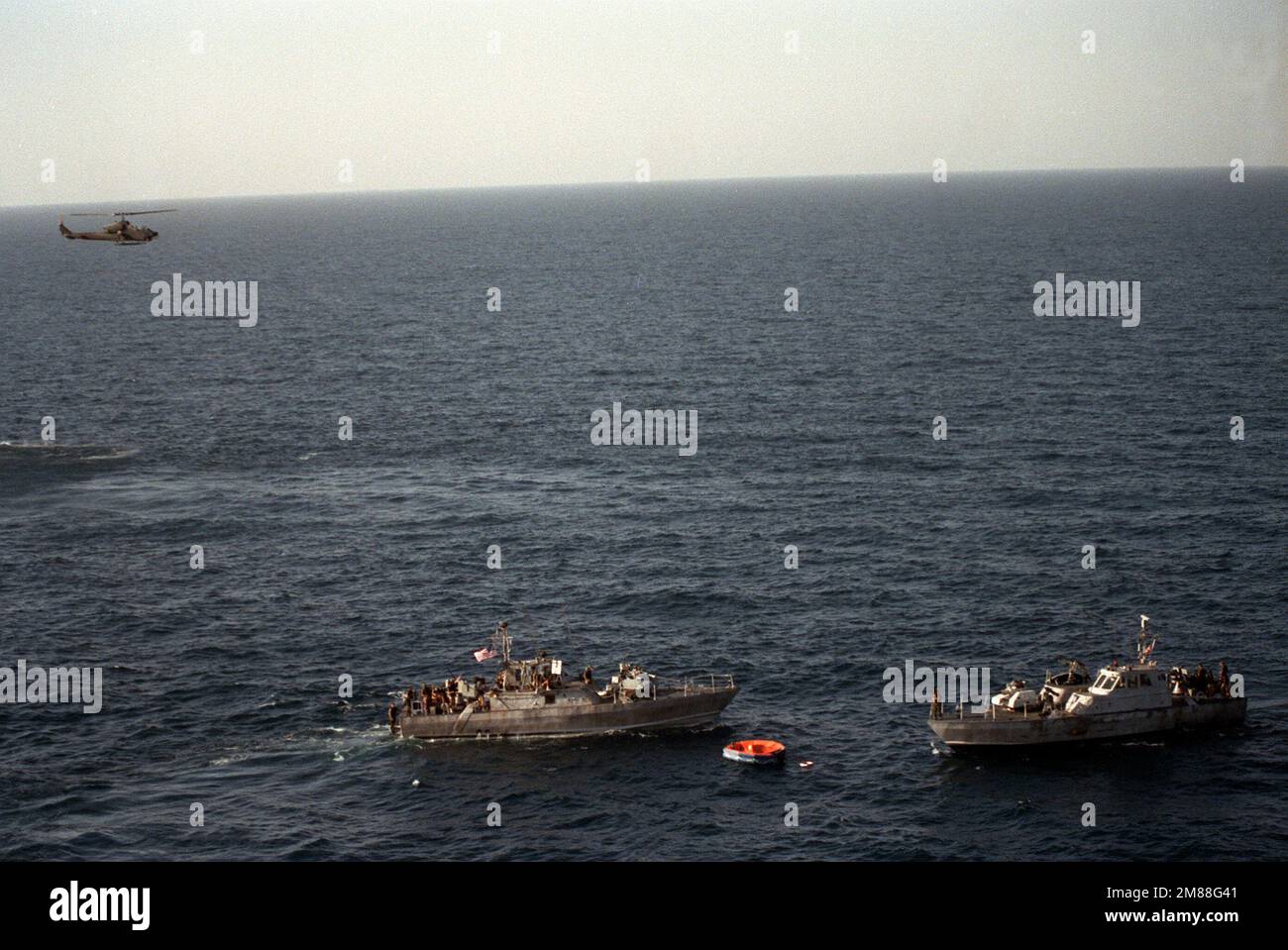 An aerial view of two U.S. Navy Mark 3 patrol craft pulling alongside ...