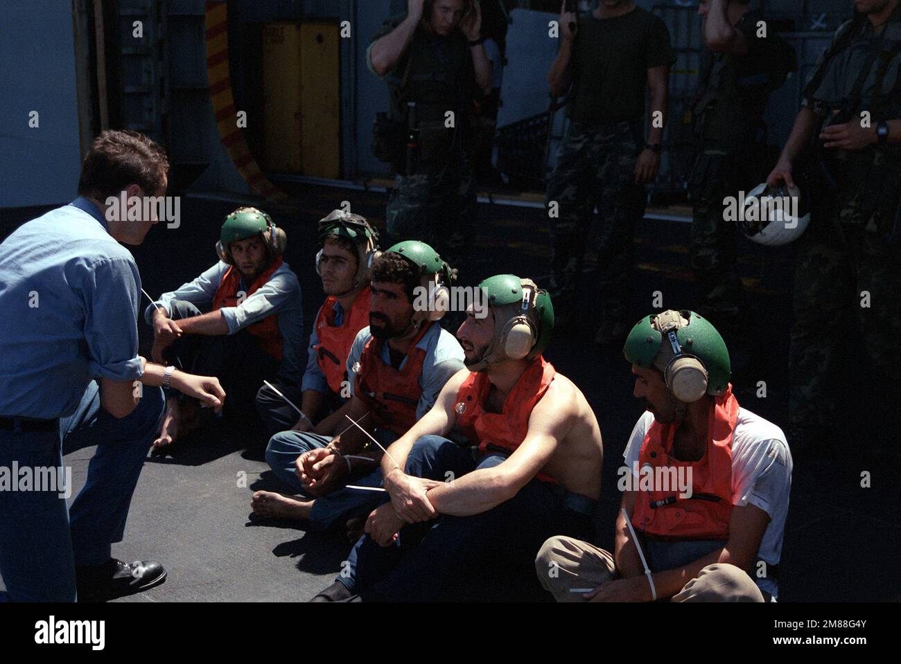 Iran detainees from the mine-laying ship IRAN AJR wear helicopter ...