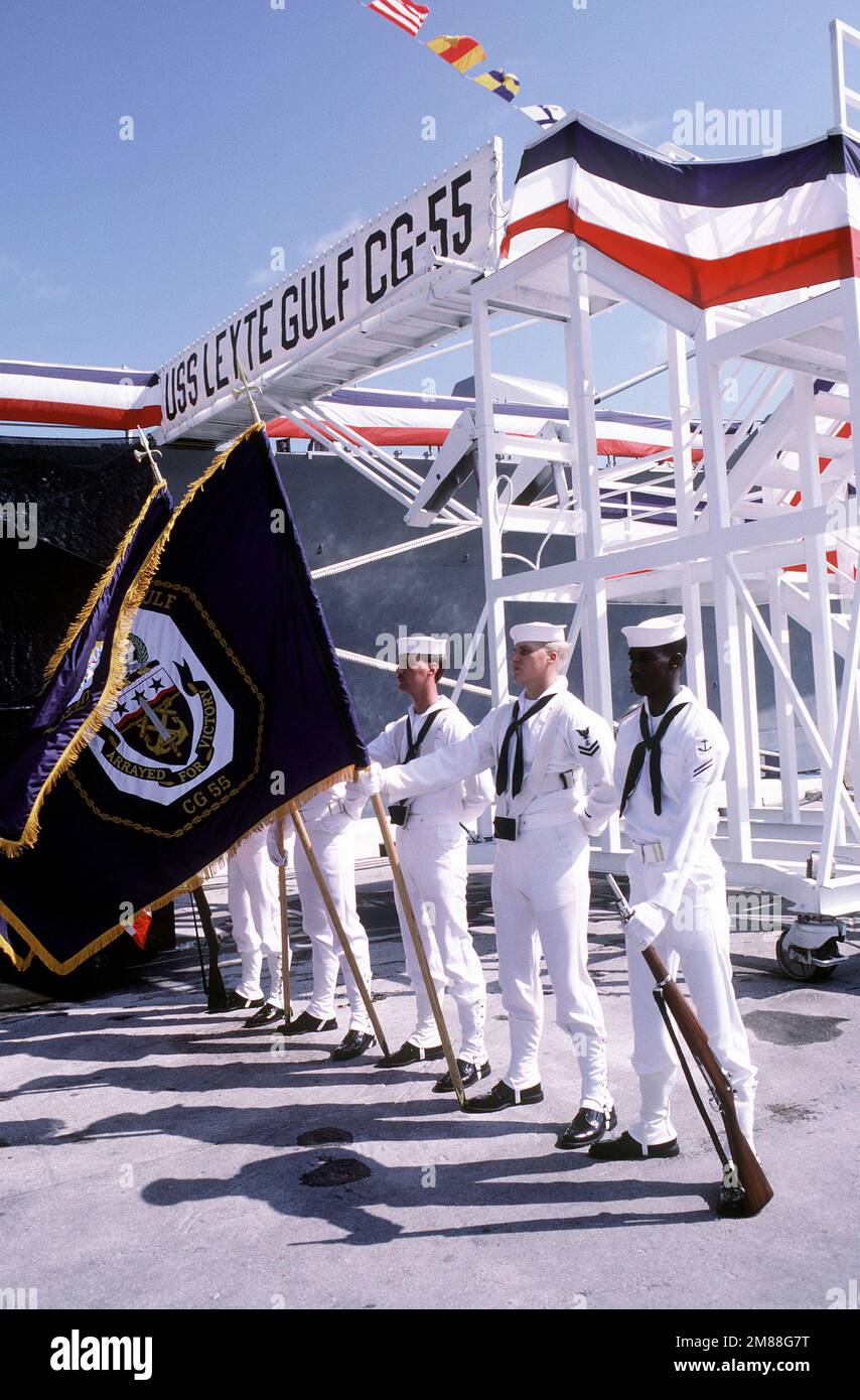 A U.S. Navy color guard presents the ship's flag during the ...