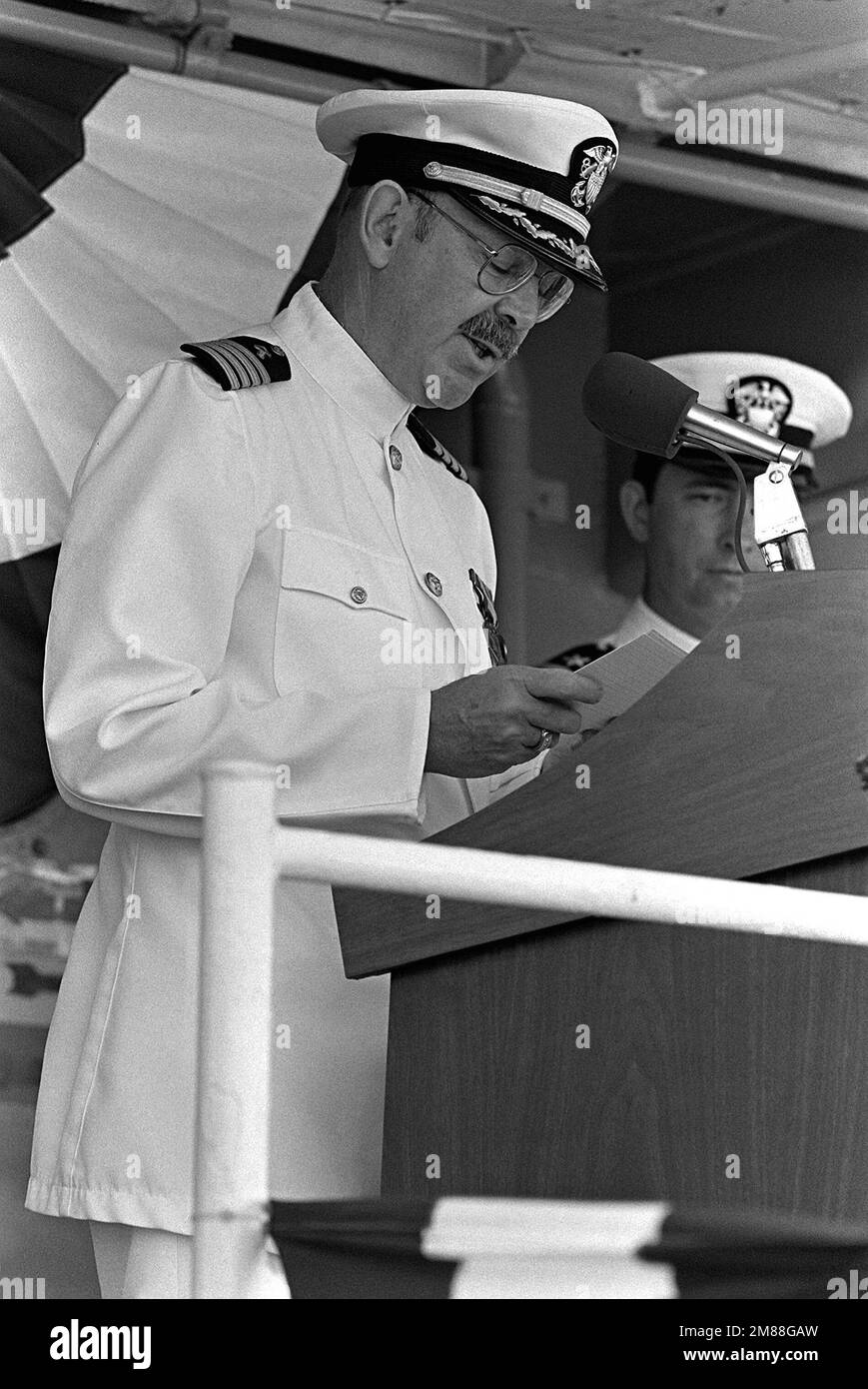 Chaplain (CAPT.) Richard Barcus speaks during recommissioning ...