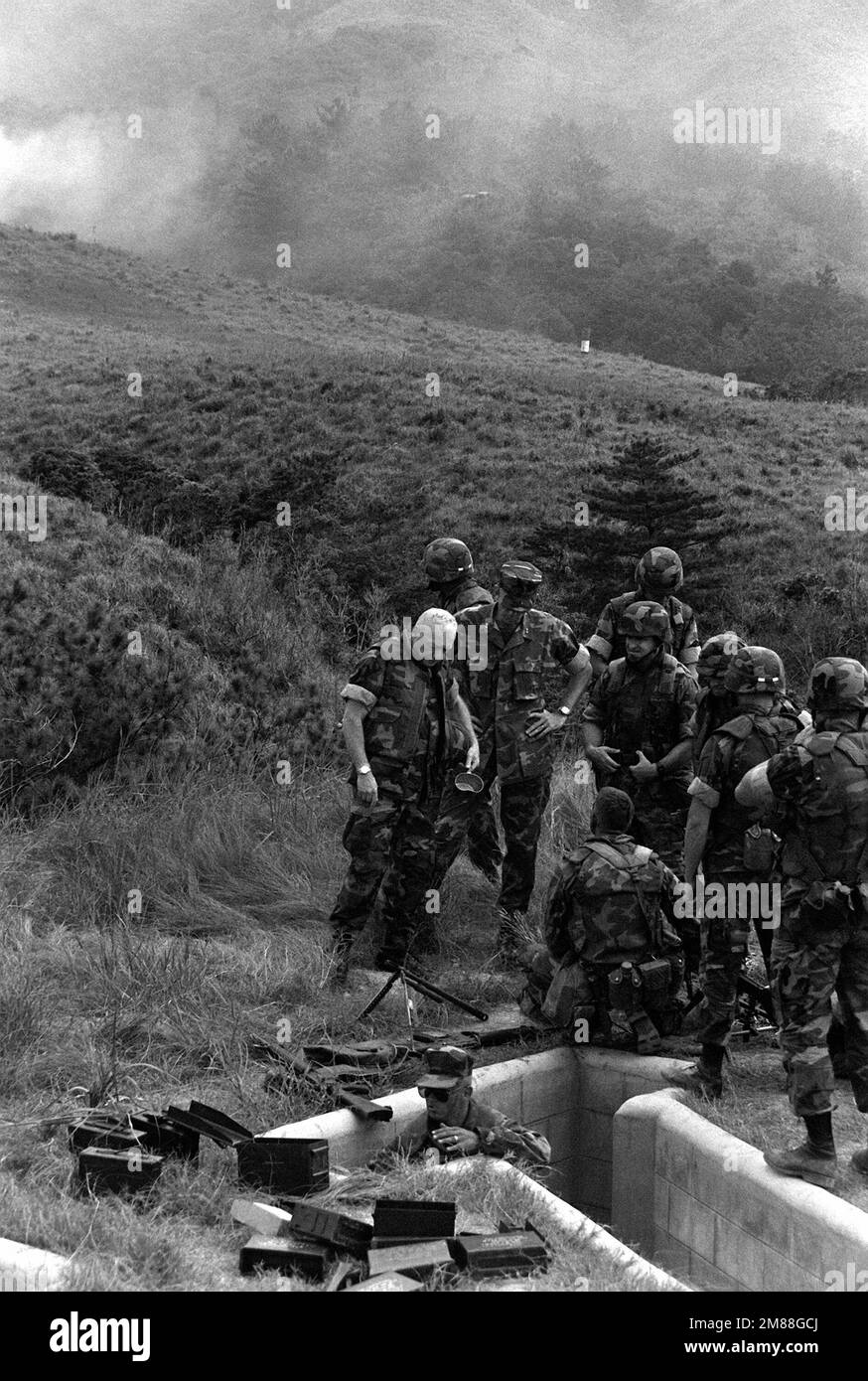 GEN Alfred M. Gray Jr., Commandant of the Marine Corps, checks weapons ...