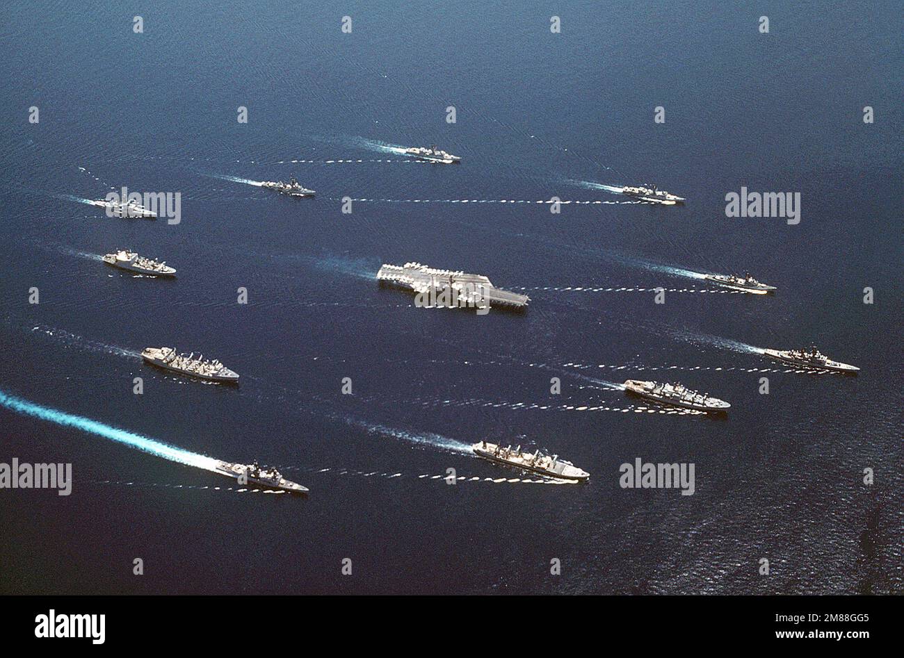An aerial starboard view of Battle Group Alfa underway. The ships are ...