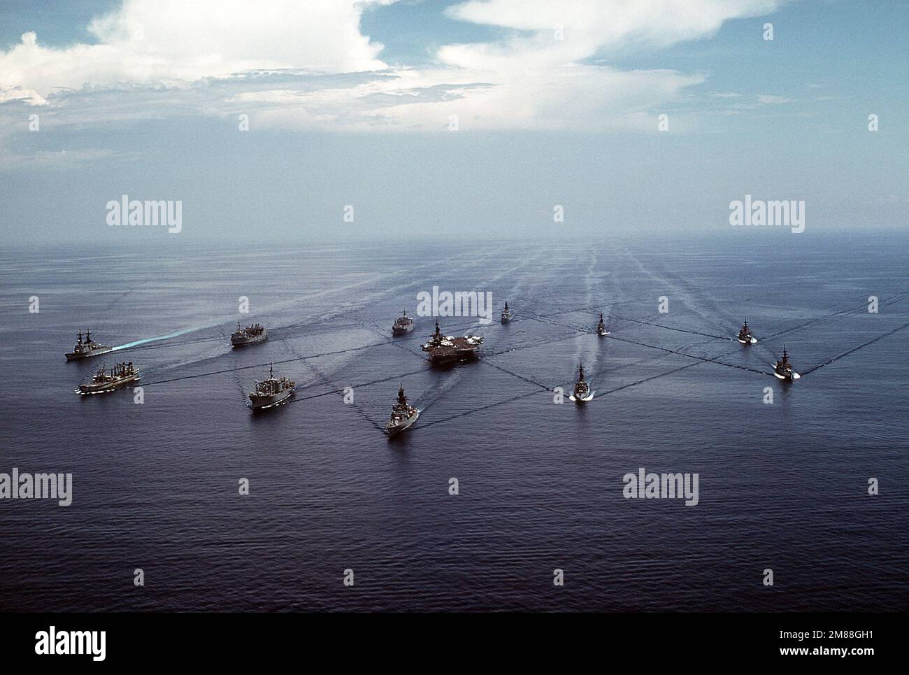 Aerial port bow view of Battle Group Alfa underway. The ships are ...