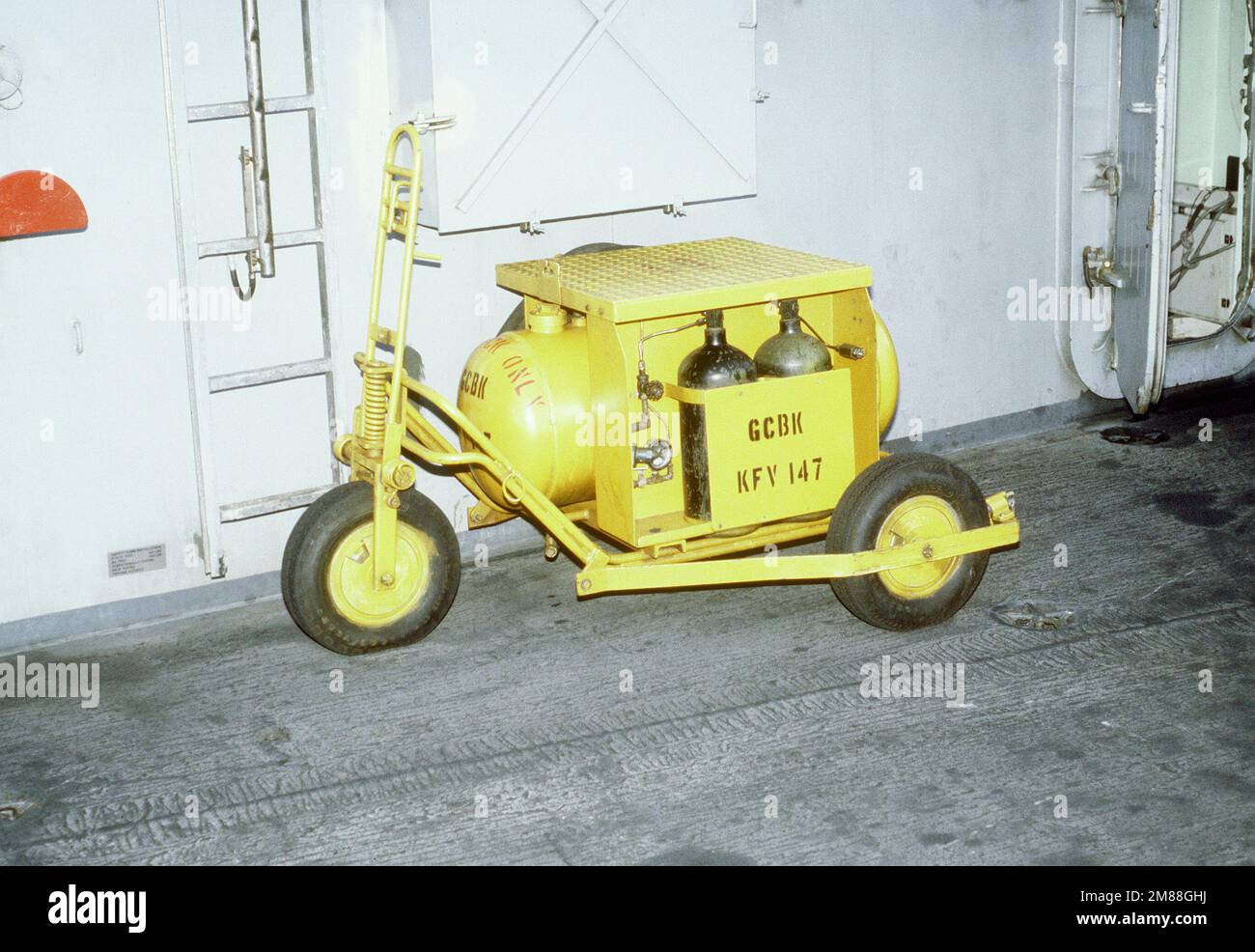 A jet engine corrosion control cart parked beside the island of the ...