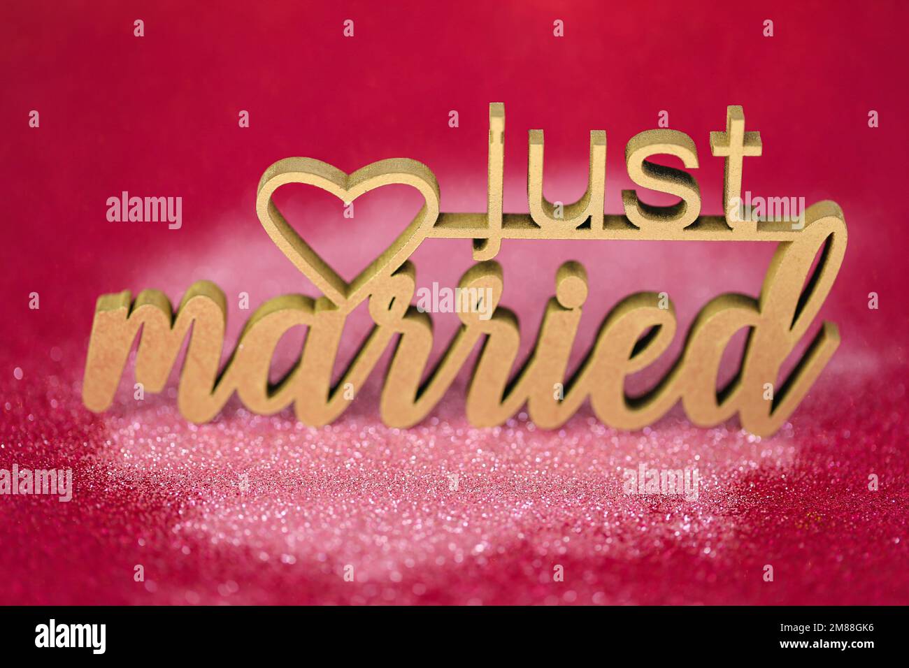 wedding symbol. just married inscription on a pink fuchsia background ...