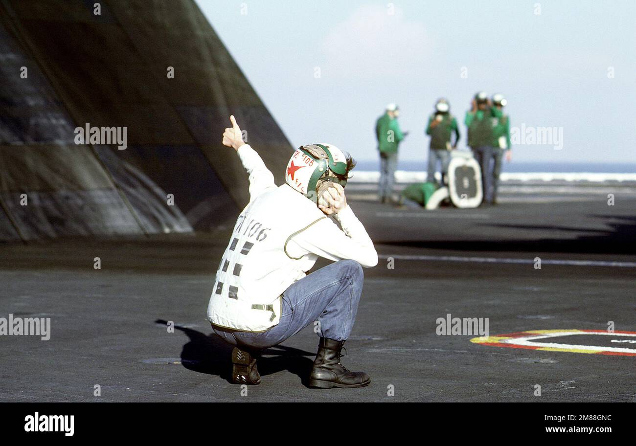 A Strike Fighter Squadron 106 (VFA-106) plane inspector gives the ...