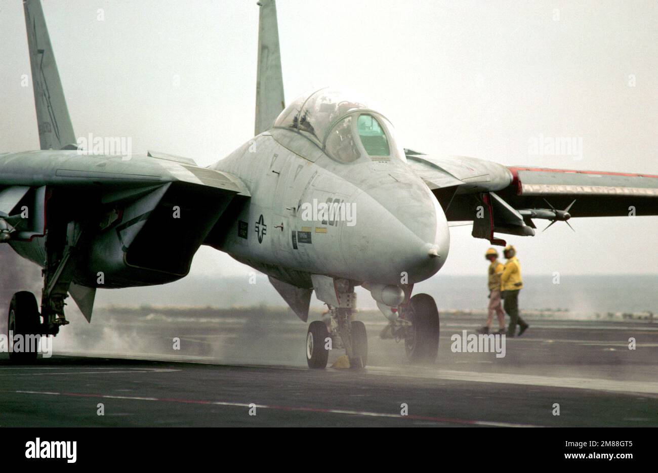 A Fighter Squadron 33 (VF-33) F-14A Tomcat aircraft is launched from ...