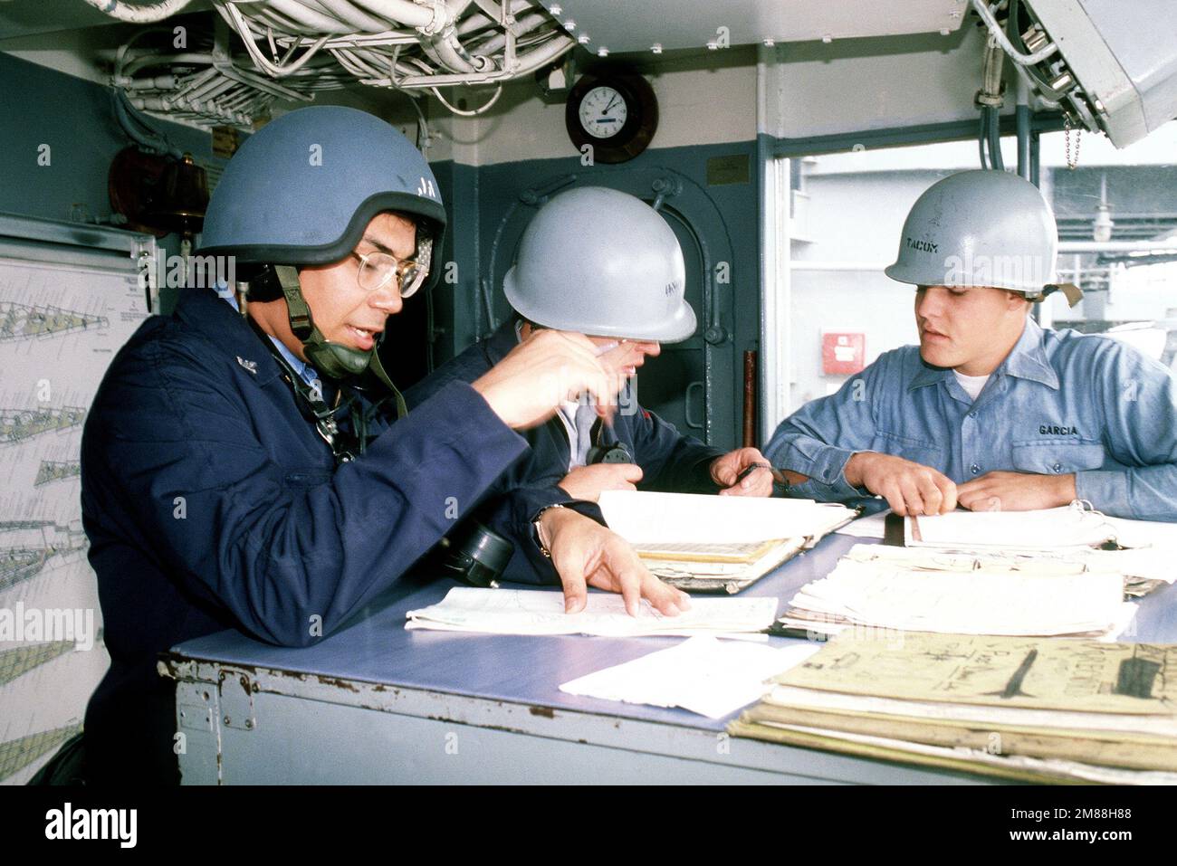 Damage control and hull technicians study counter-flooding charts in ...