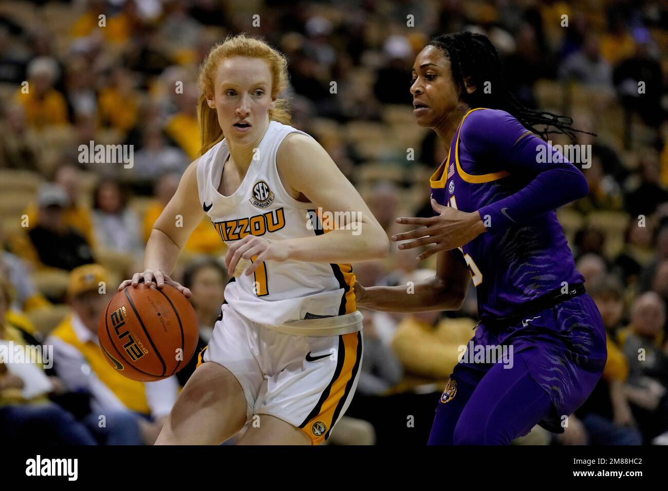 Missouri's Lauren Hansen (1) heads to the basket as LSU's Alexis Morris ...