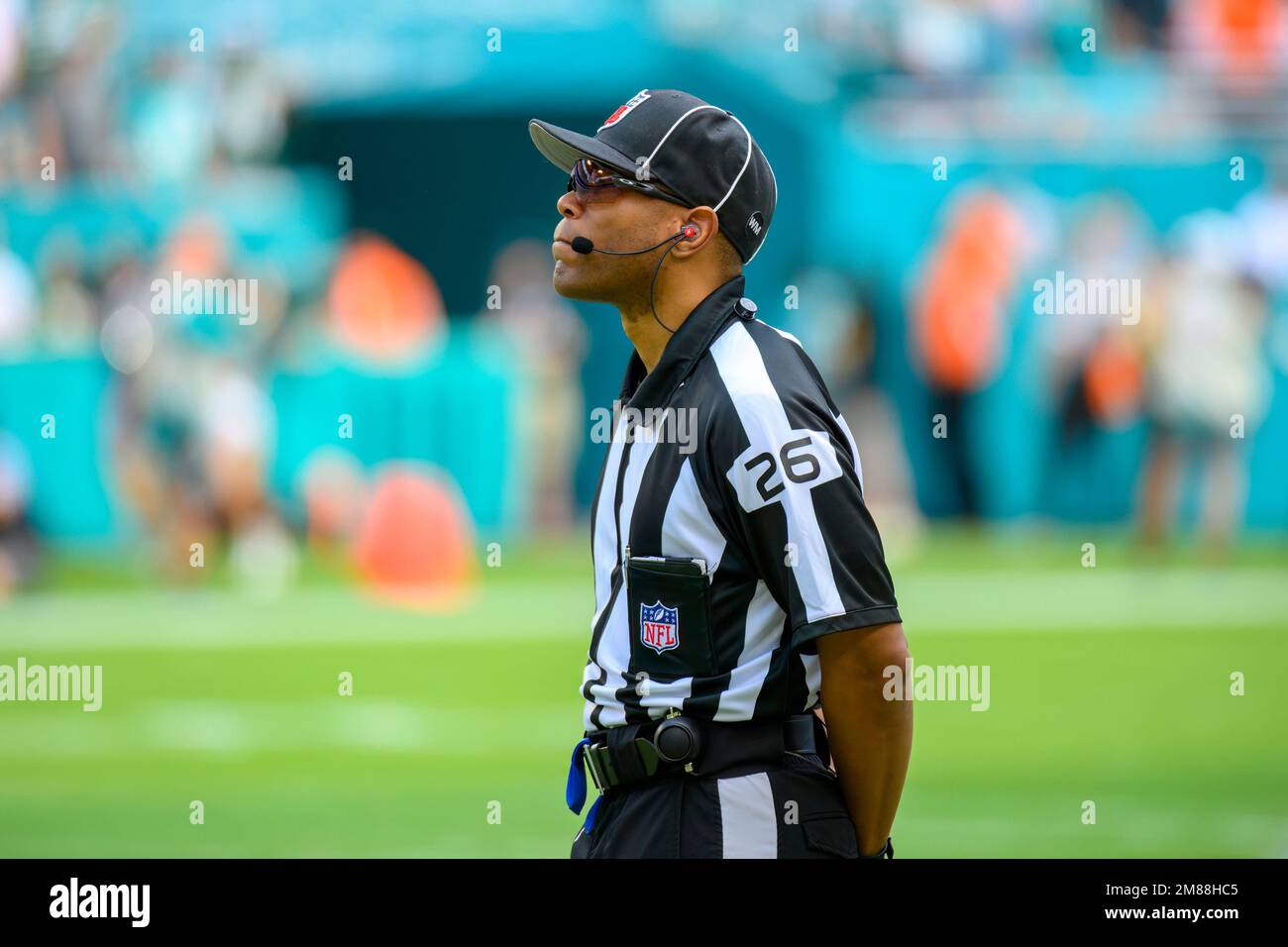 NFL side judge Allen Baynes stands on the field during an NFL football ...
