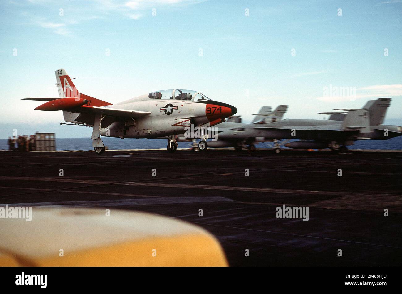 A T-2C Buckeye aircraft lands aboard the nuclear-powered aircraft ...