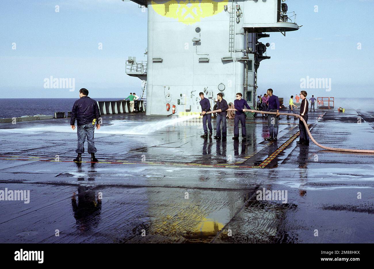 Crewmen hose down flight hi-res stock photography and images - Alamy
