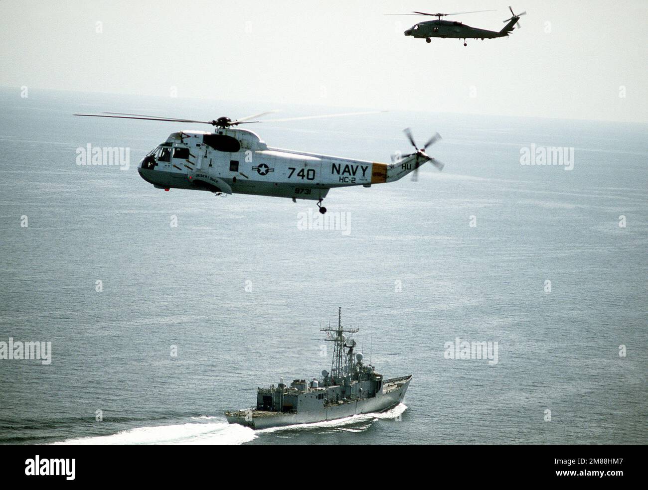 An air-to-air left side view of a Helicopter Combat Support Squadron 2 ...