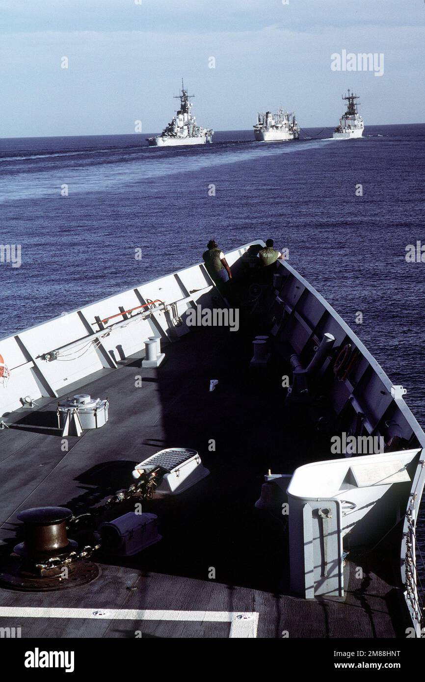 Crewmen watch for mines from the bow of the guided missile frigate USS ...
