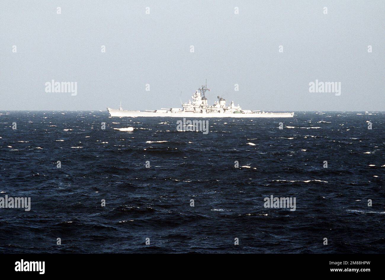 A port beam view of the battleship USS WISCONSIN (BB-64) underway on ...