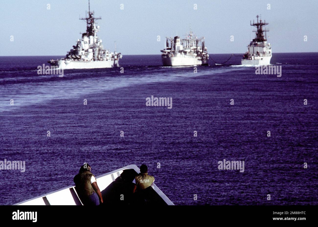 Crewmen watch for mines from the bow of the guided missile frigate USS ...