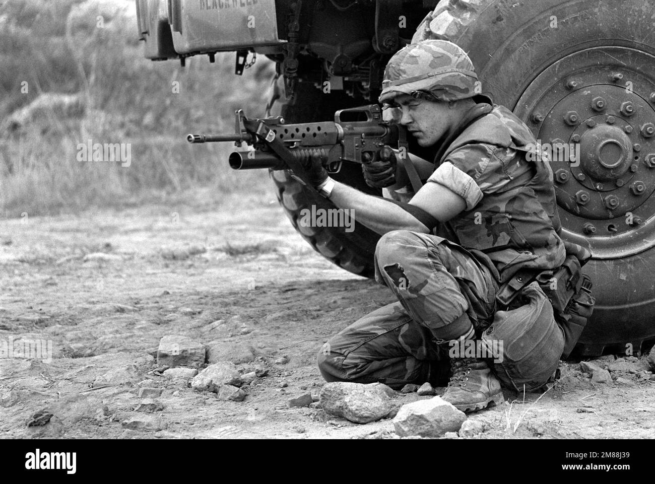 A Marine from Co. L, 4th Bn., 12th Marines, fires his M-16A1 rifle with ...