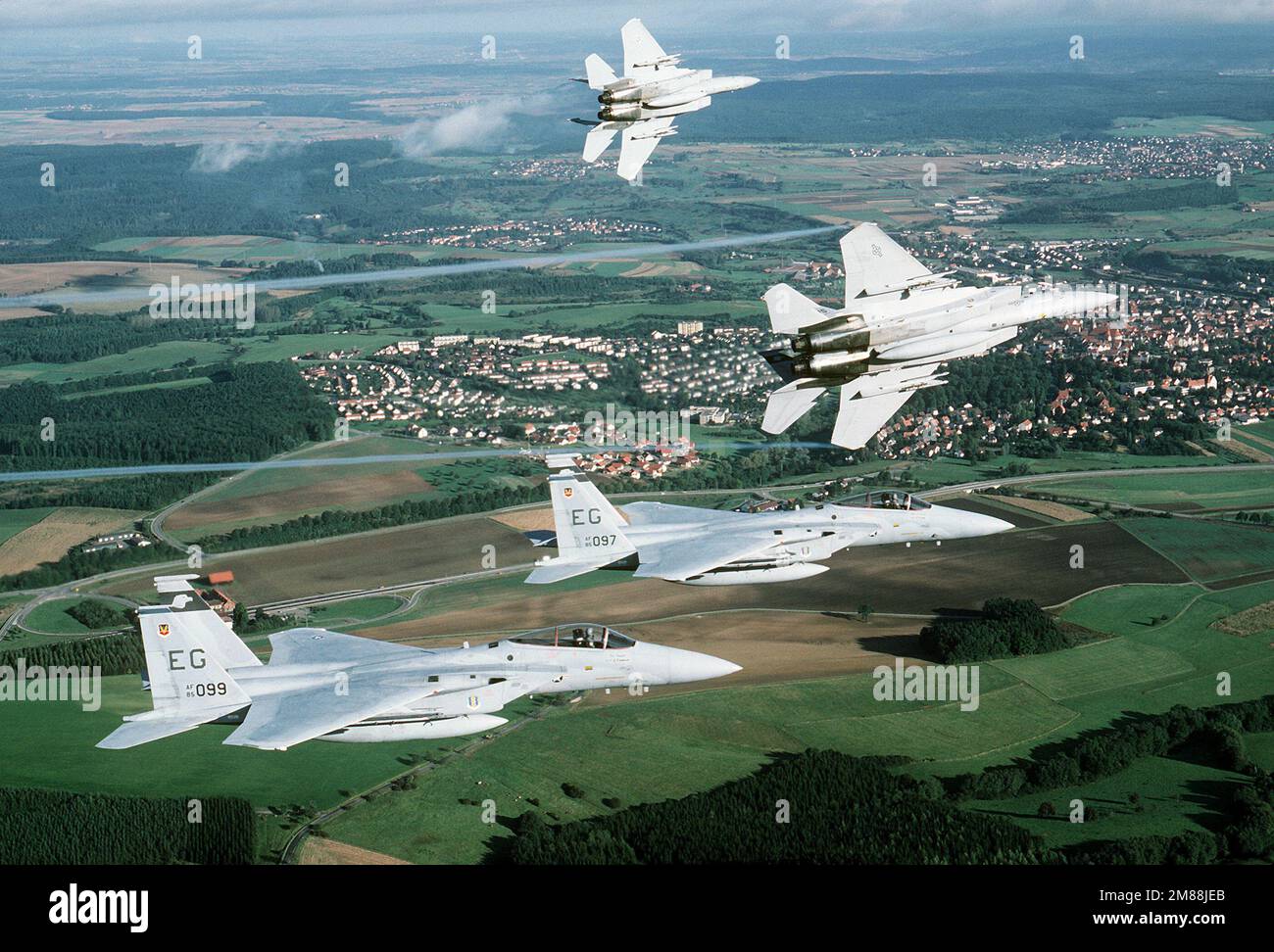 An air-to-air right side view of two 58th Tactical Fighter Squadron F ...