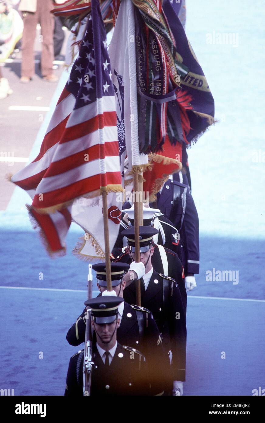 A joint services color guard parades the colors during the dedication ...