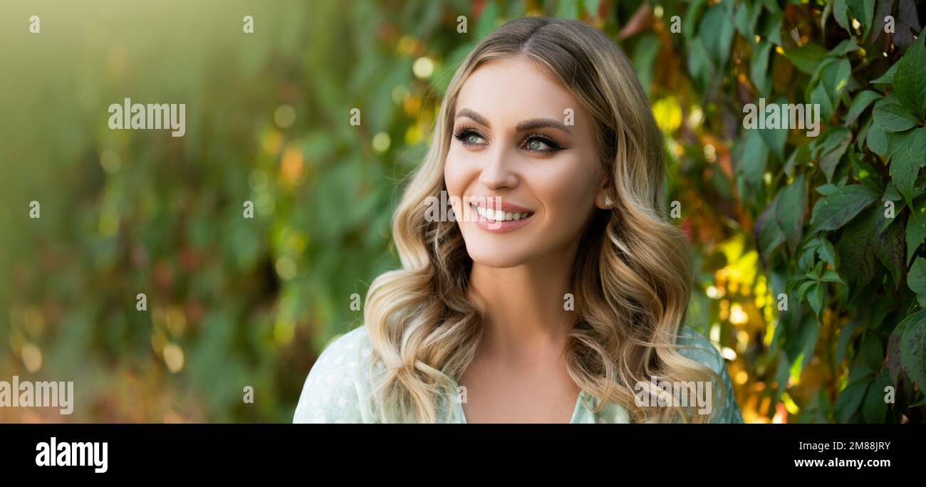 Portrait of sensual woman in spring background. Banner for website header. Portrait of young ...