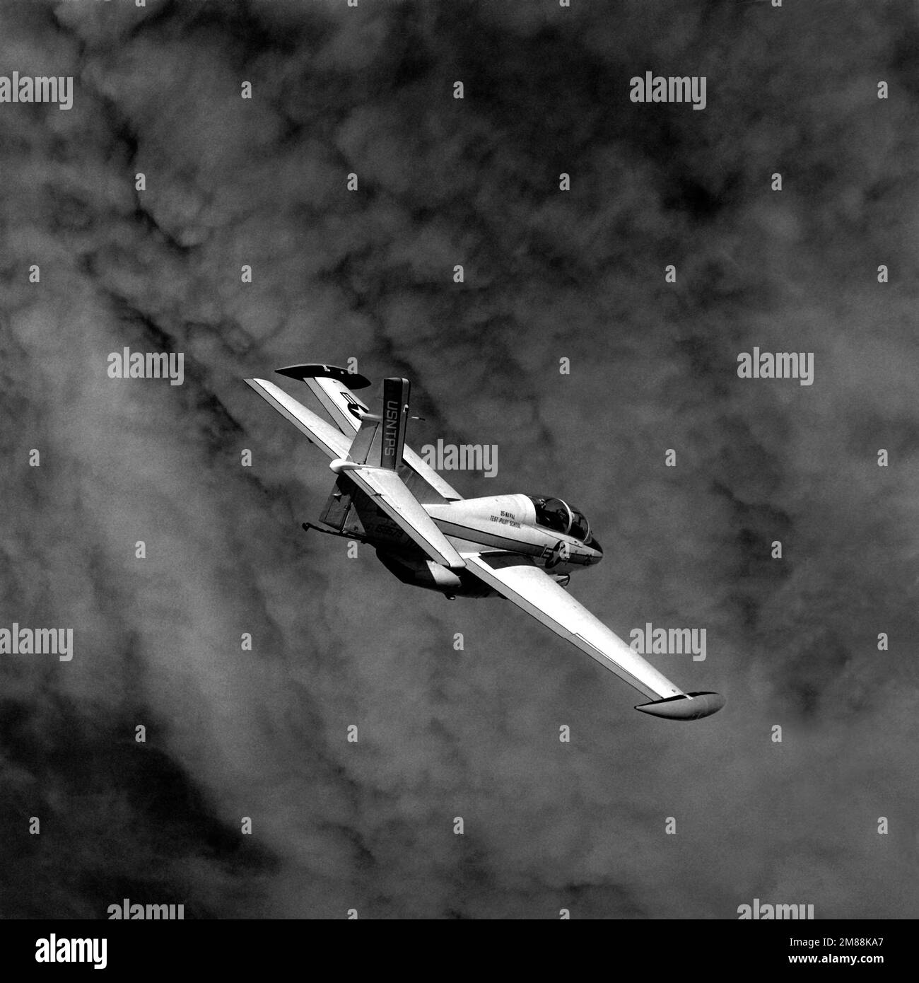 An air-to-air right rear view of a T-2C Buckeye aircraft during ...