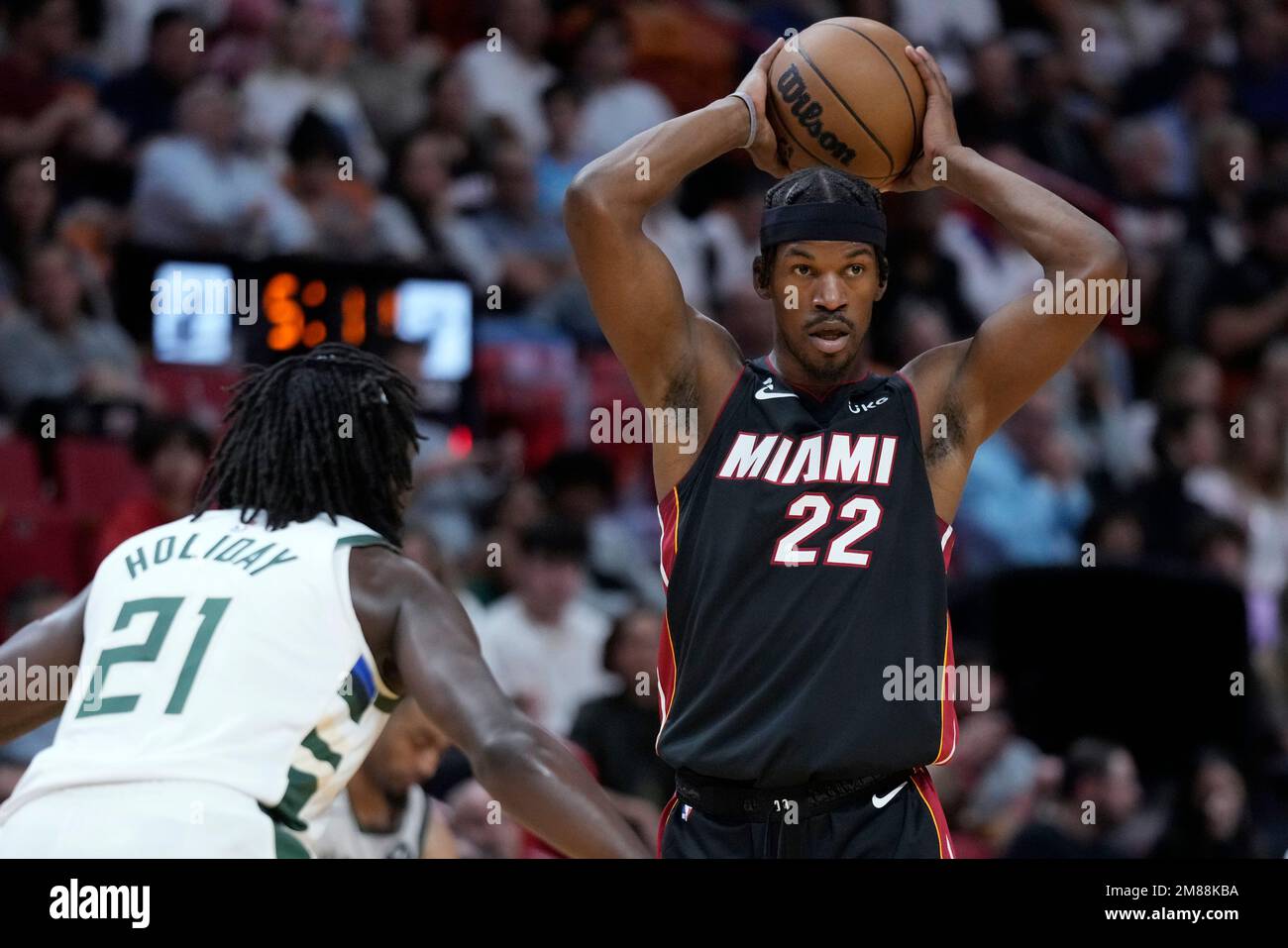 Miami Heat forward Jimmy Butler (22) looks for an open teammate past ...