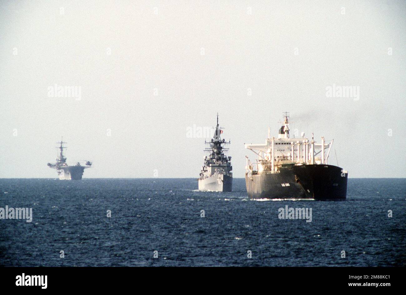 A starboard bow view of ships from tanker convoy No. 12 underway in the ...