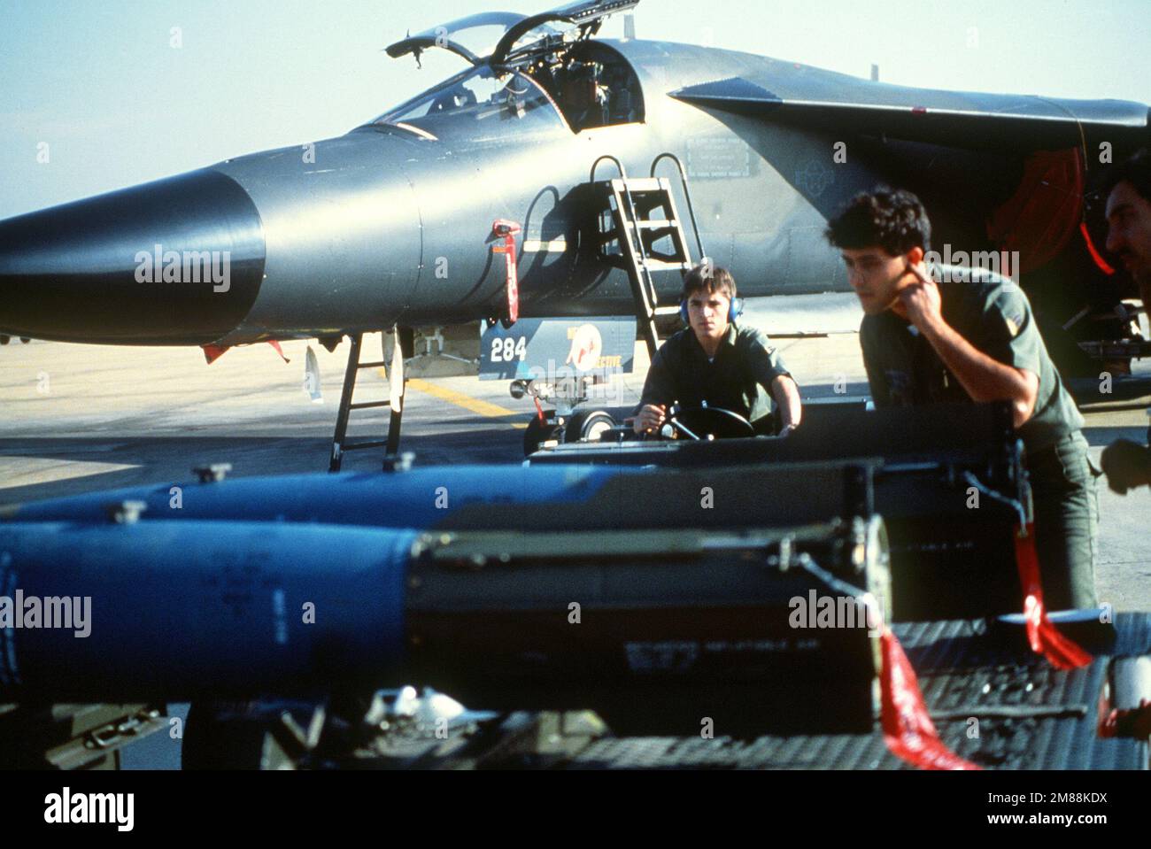 Members of the 509th Organizational Maintenance Squadron move BDU-50A/B ...